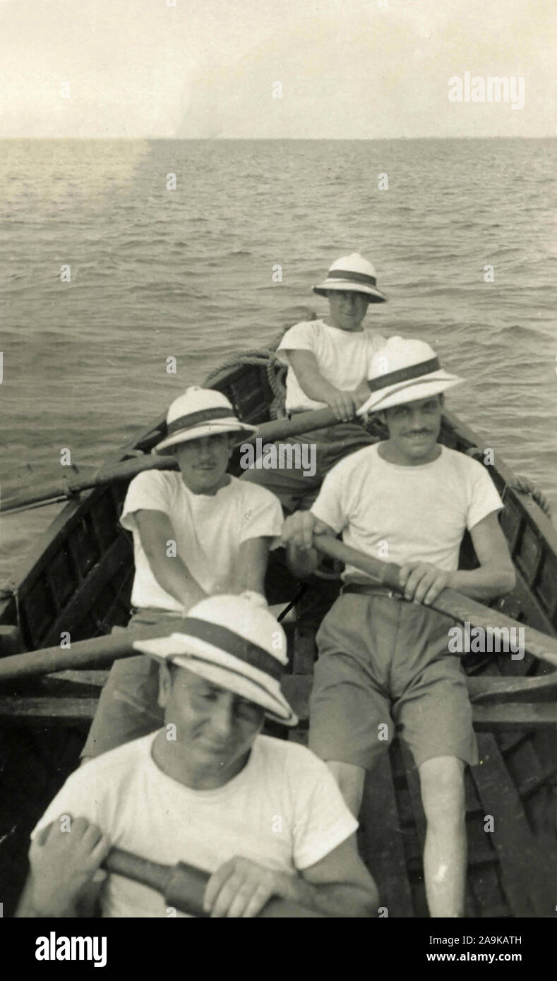 Four Men in a Boat Stock Photo - Alamy