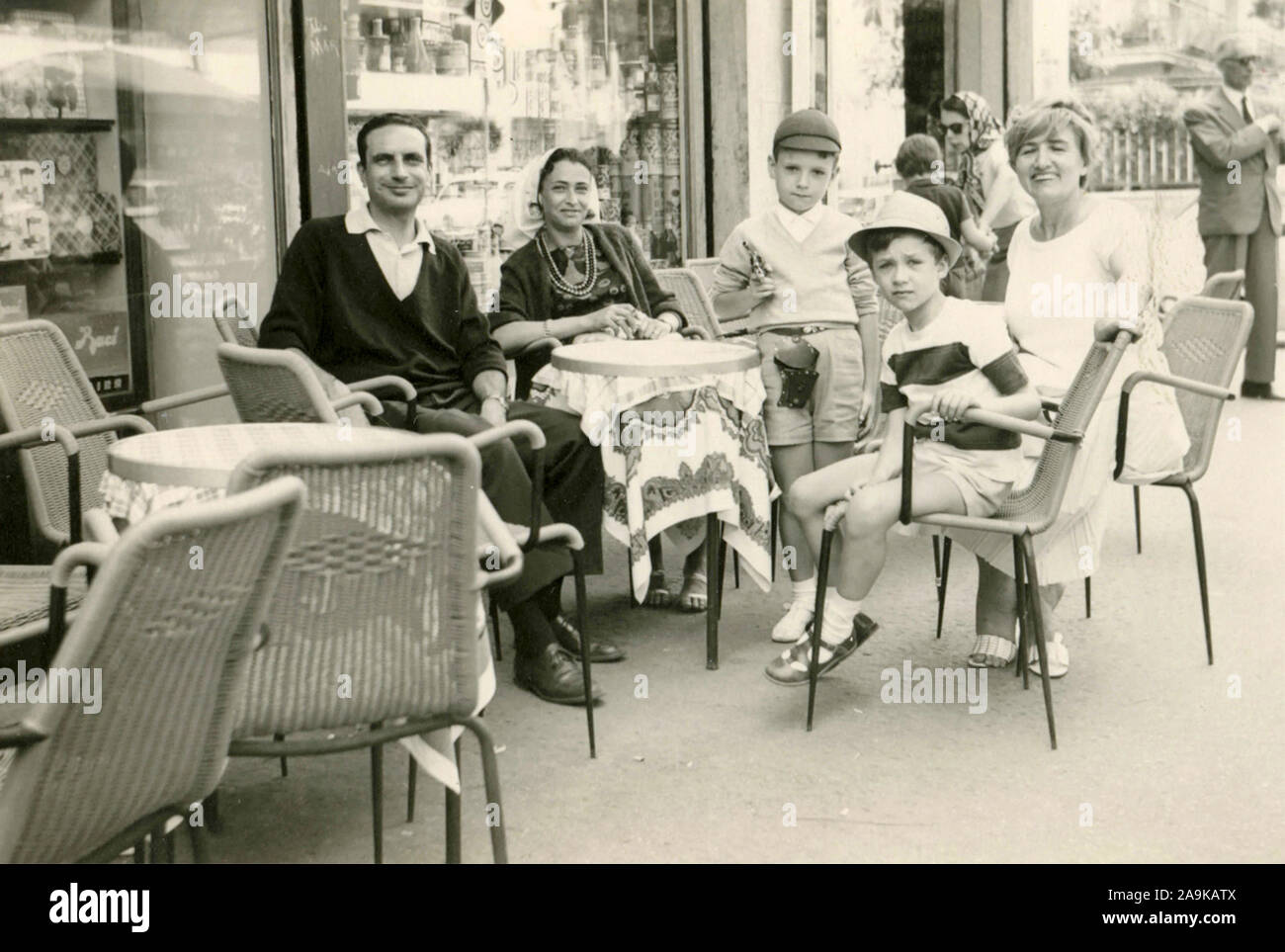 Family at a cafe Stock Photo - Alamy