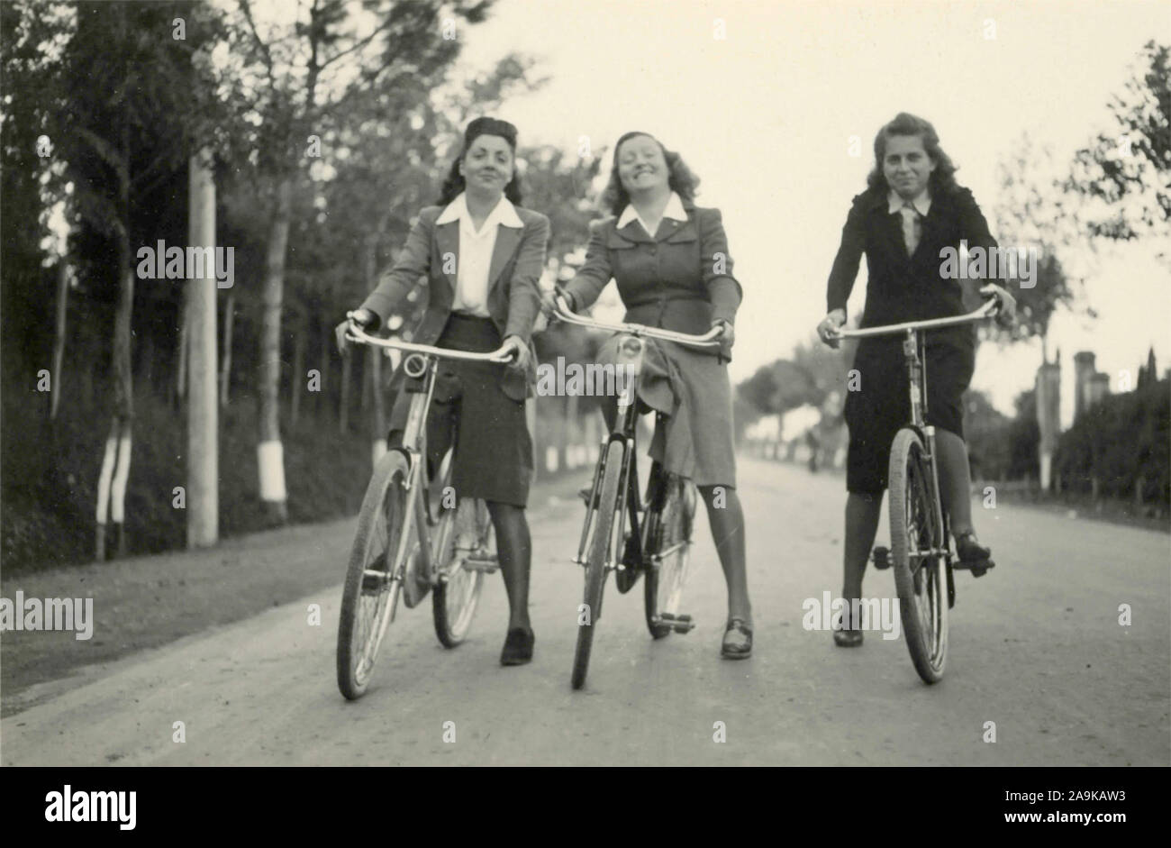 Three girls on bike Stock Photo - Alamy