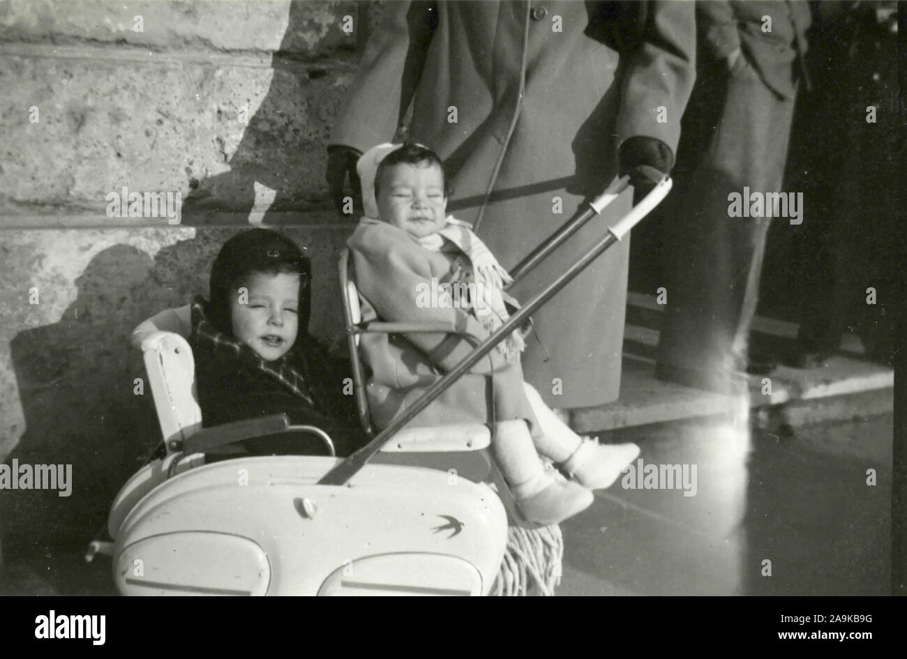 Two children on the stroller Stock Photo - Alamy