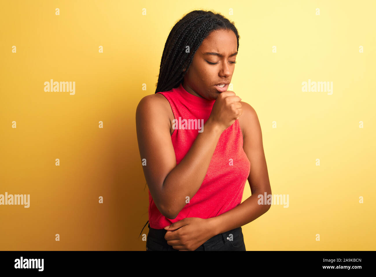 African american woman wearing red casual t-shirt standing over ...