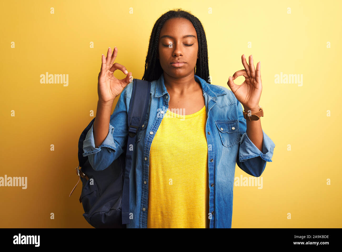 African american student woman wearing backpack standing over isolated ...