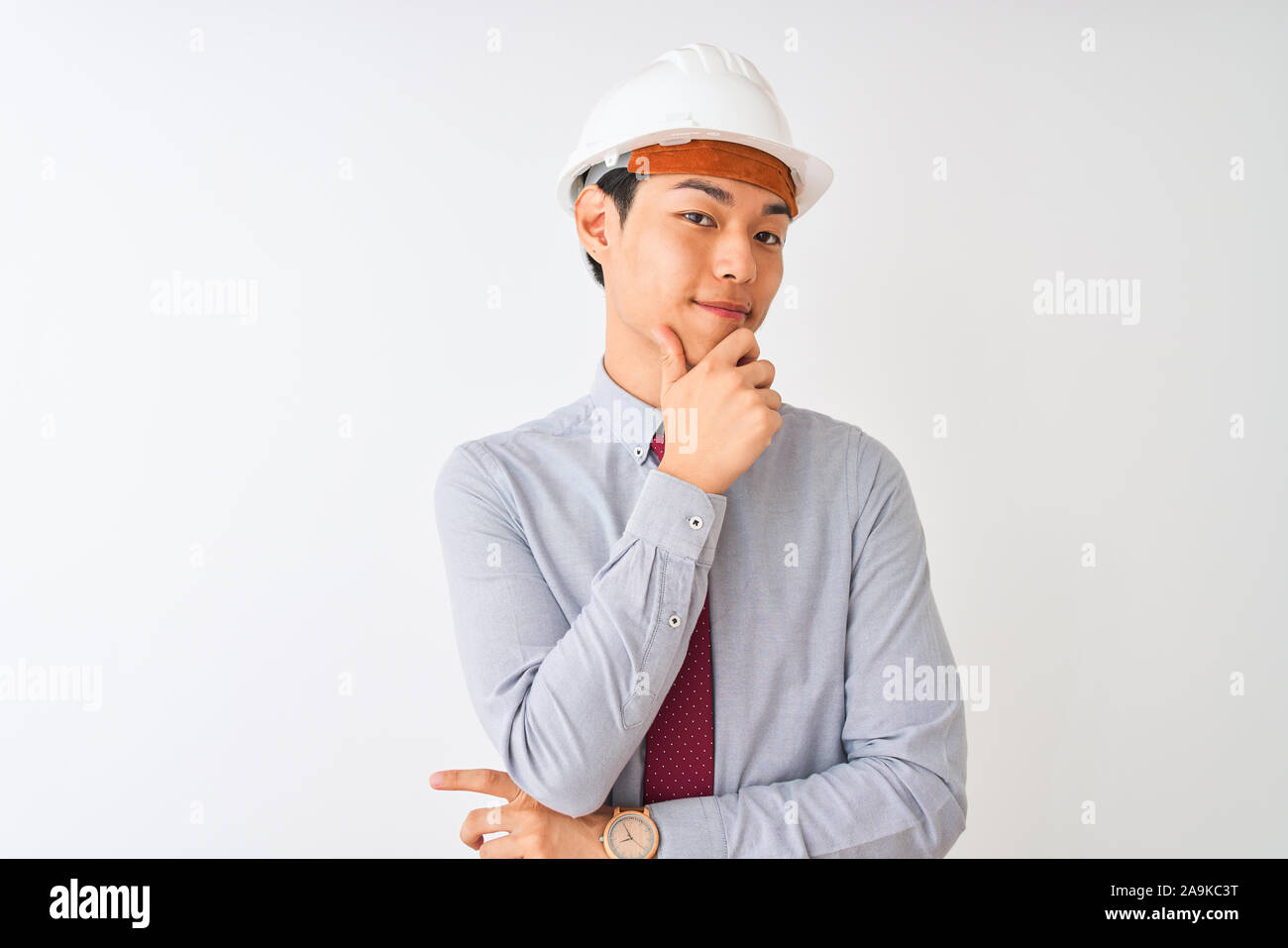 Chinese architect man wearing tie and helmet standing over isolated ...