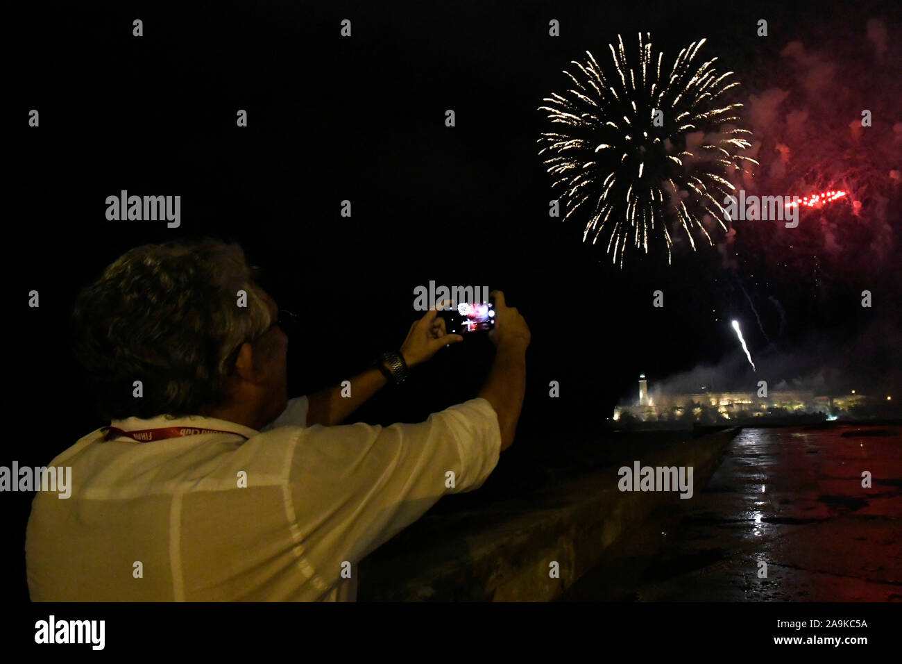Havana, Cuba. 15th Nov, 2019. A man takes photos of a firework show ...