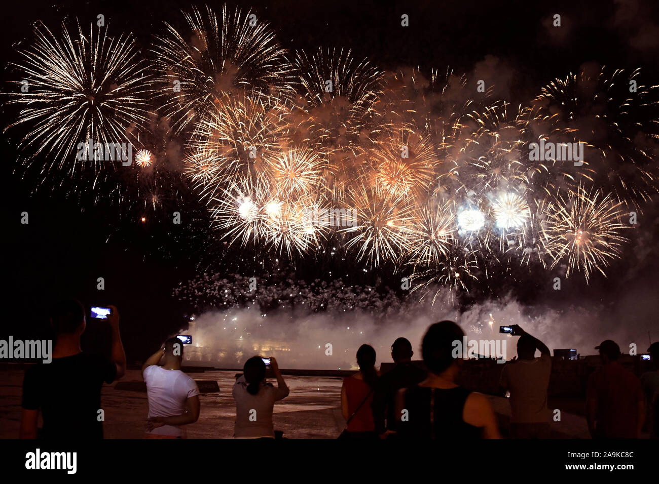 Havana, Cuba. 15th Nov, 2019. People watch a firework show held to ...