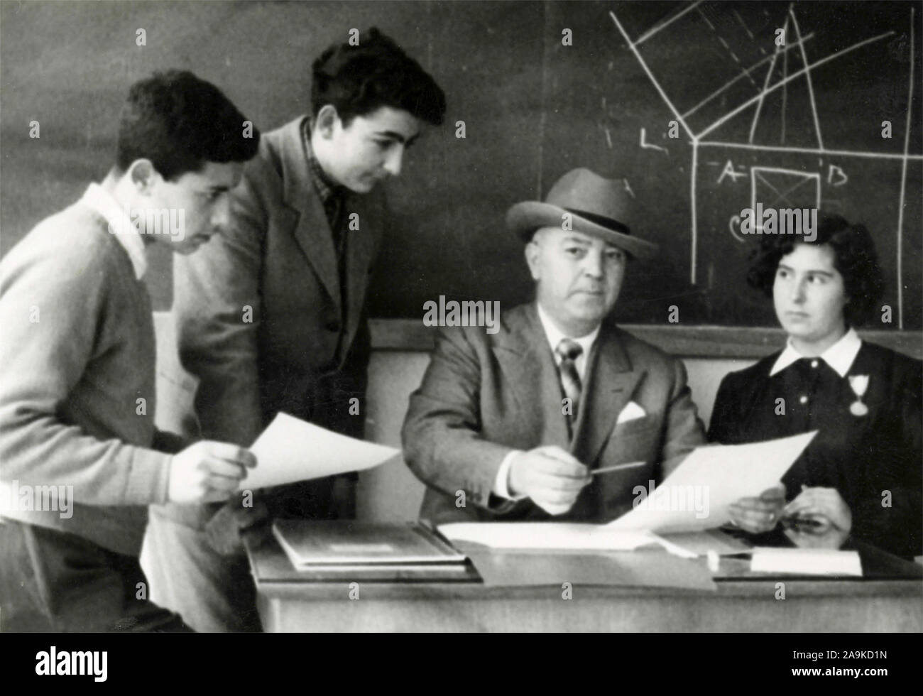 The teacher corrects homework, Italy Stock Photo - Alamy