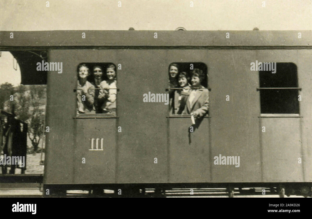 People looking out the window of a train, Italy Stock Photo - Alamy