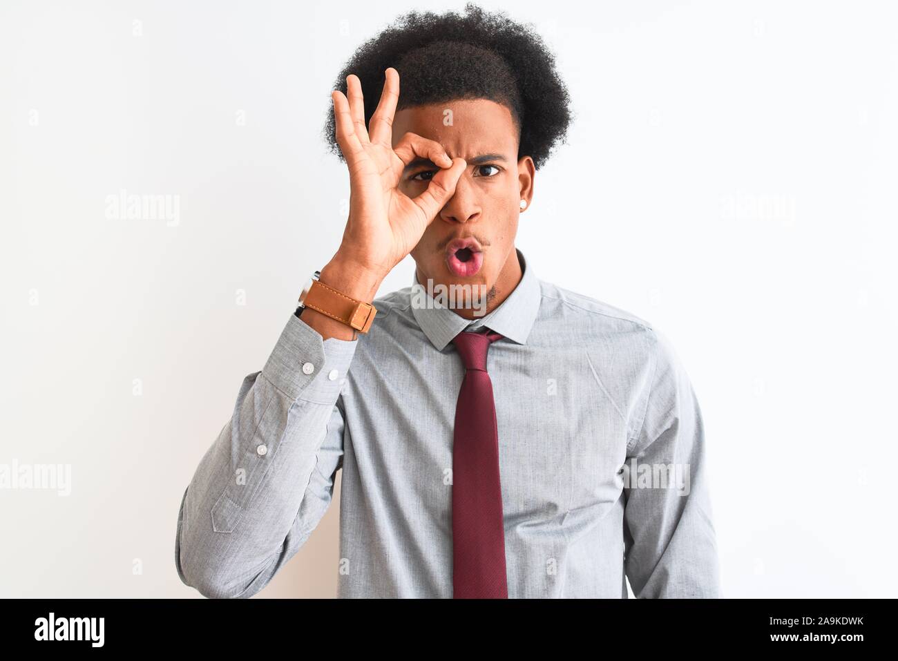 Young african american businessman wearing tie standing over isolated ...