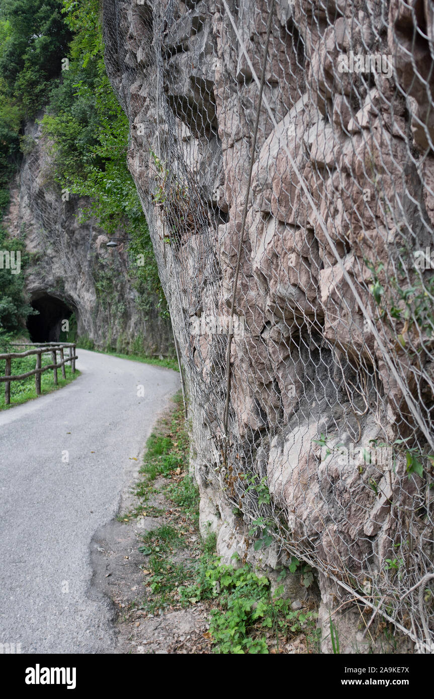 rockfall protection nets, installed to protect an rock wall Stock Photo ...
