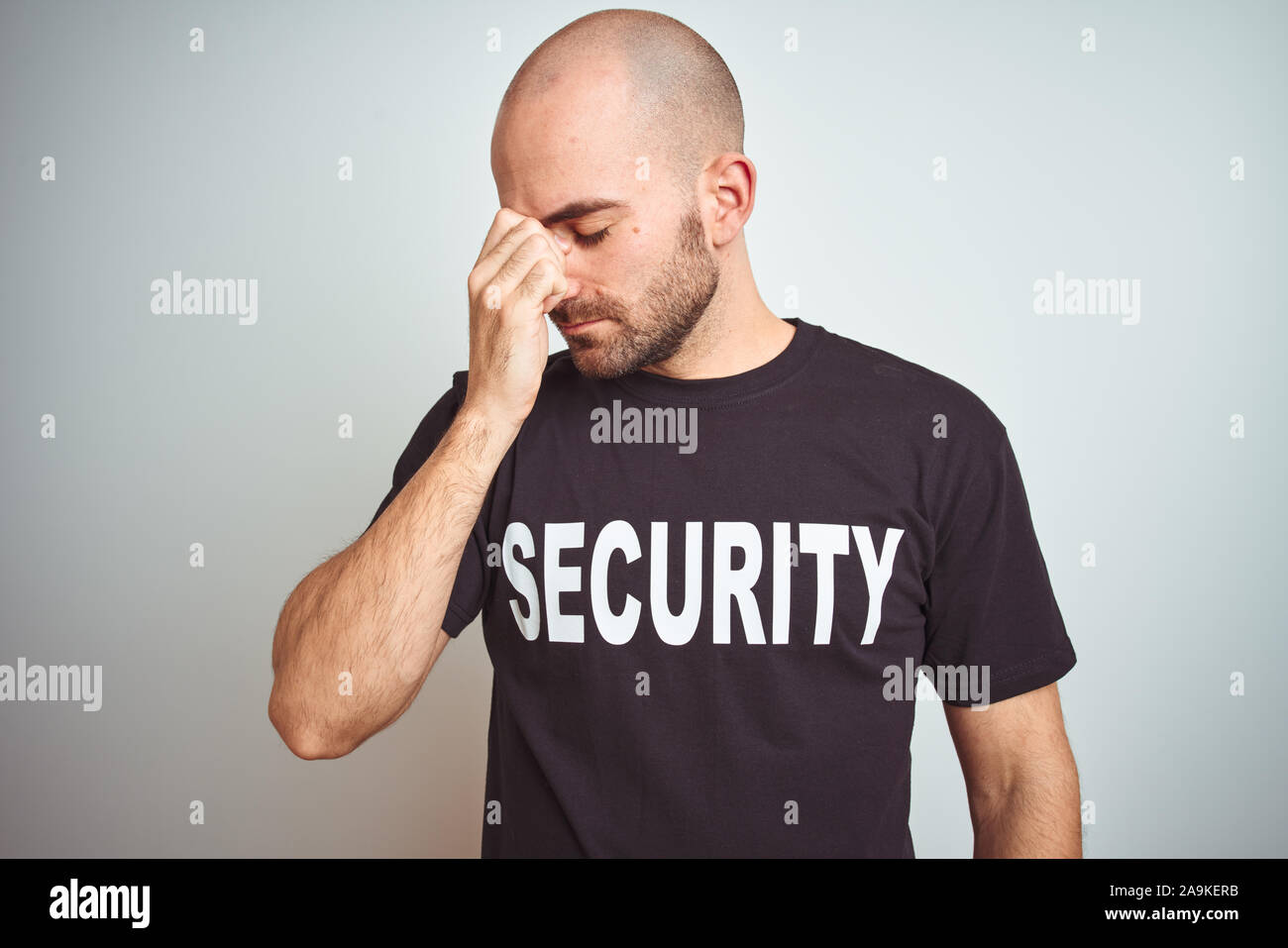 Young safeguard man wearing security uniform over isolated background ...