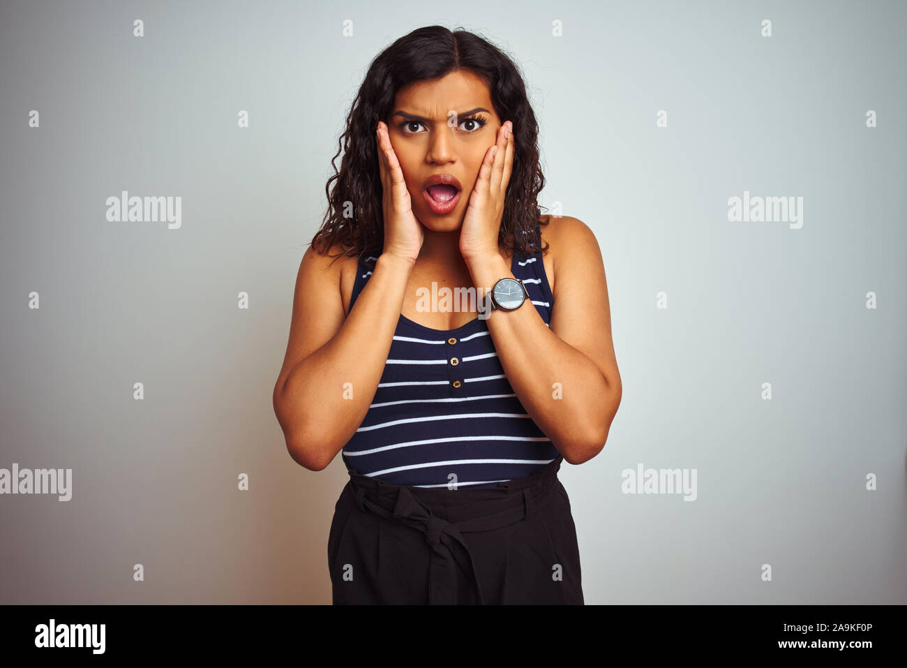 Transsexual transgender woman wearing striped t-shirt over isolated ...