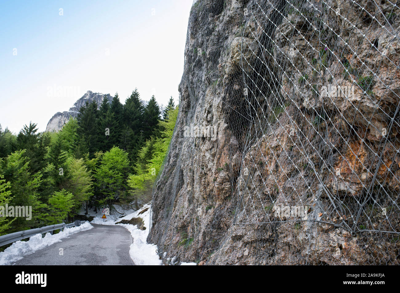 rockfall protection nets, installed to protect an rock wall Stock Photo ...