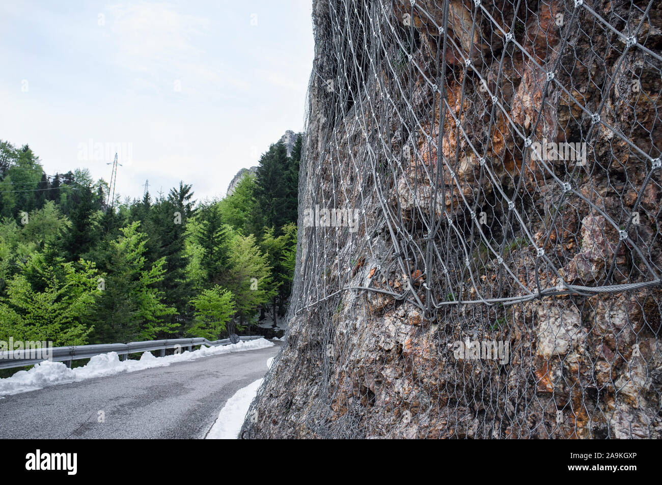 rockfall protection nets, installed to protect an rock wall Stock Photo ...