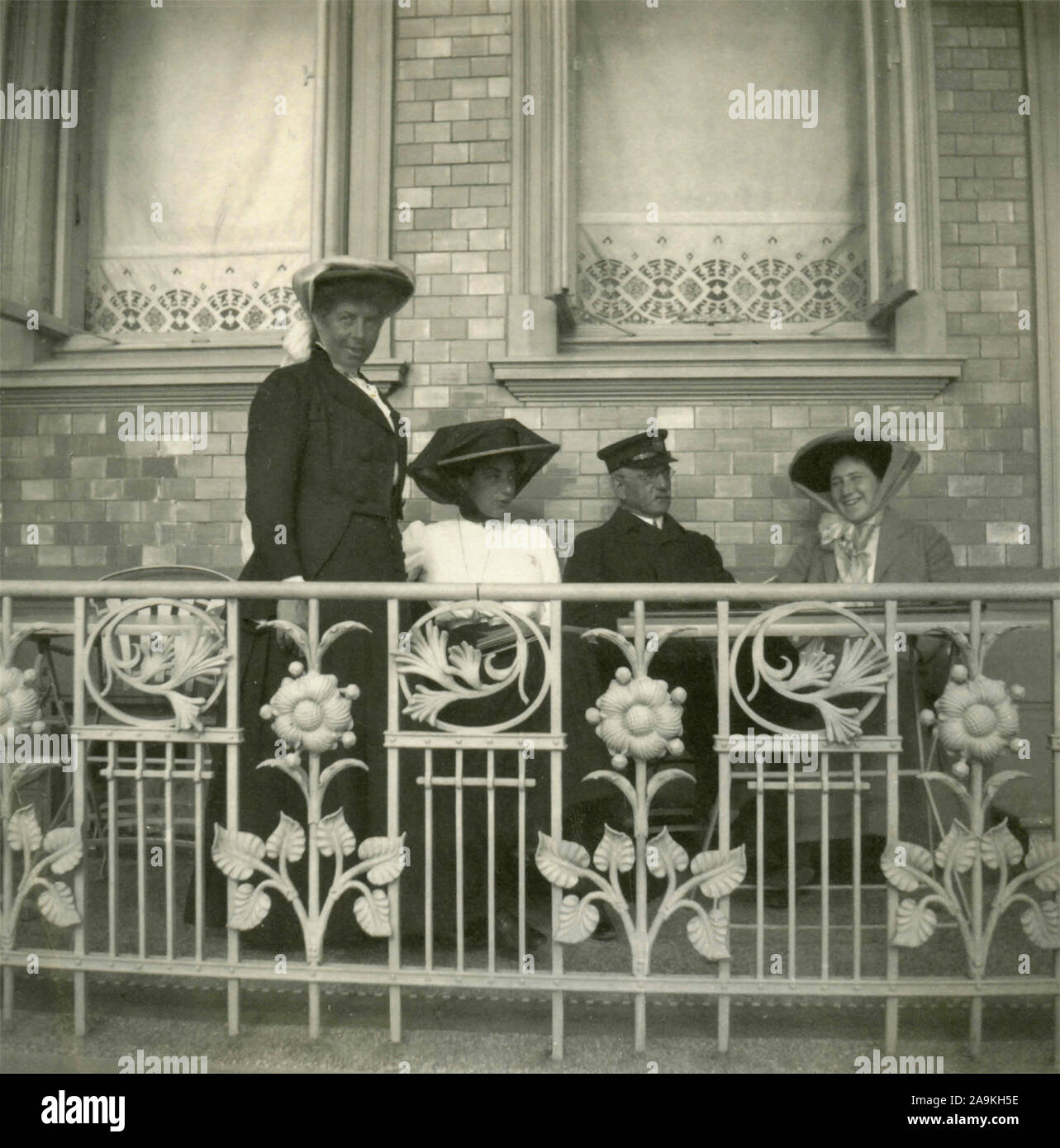 Elegant family group in a balcony, Italy Stock Photo - Alamy