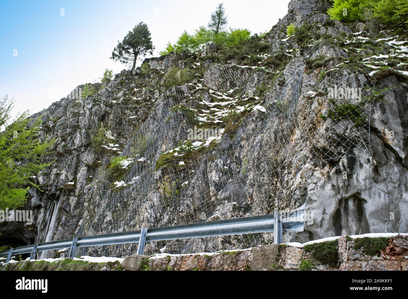 rockfall protection nets, installed to protect an rock wall Stock Photo ...