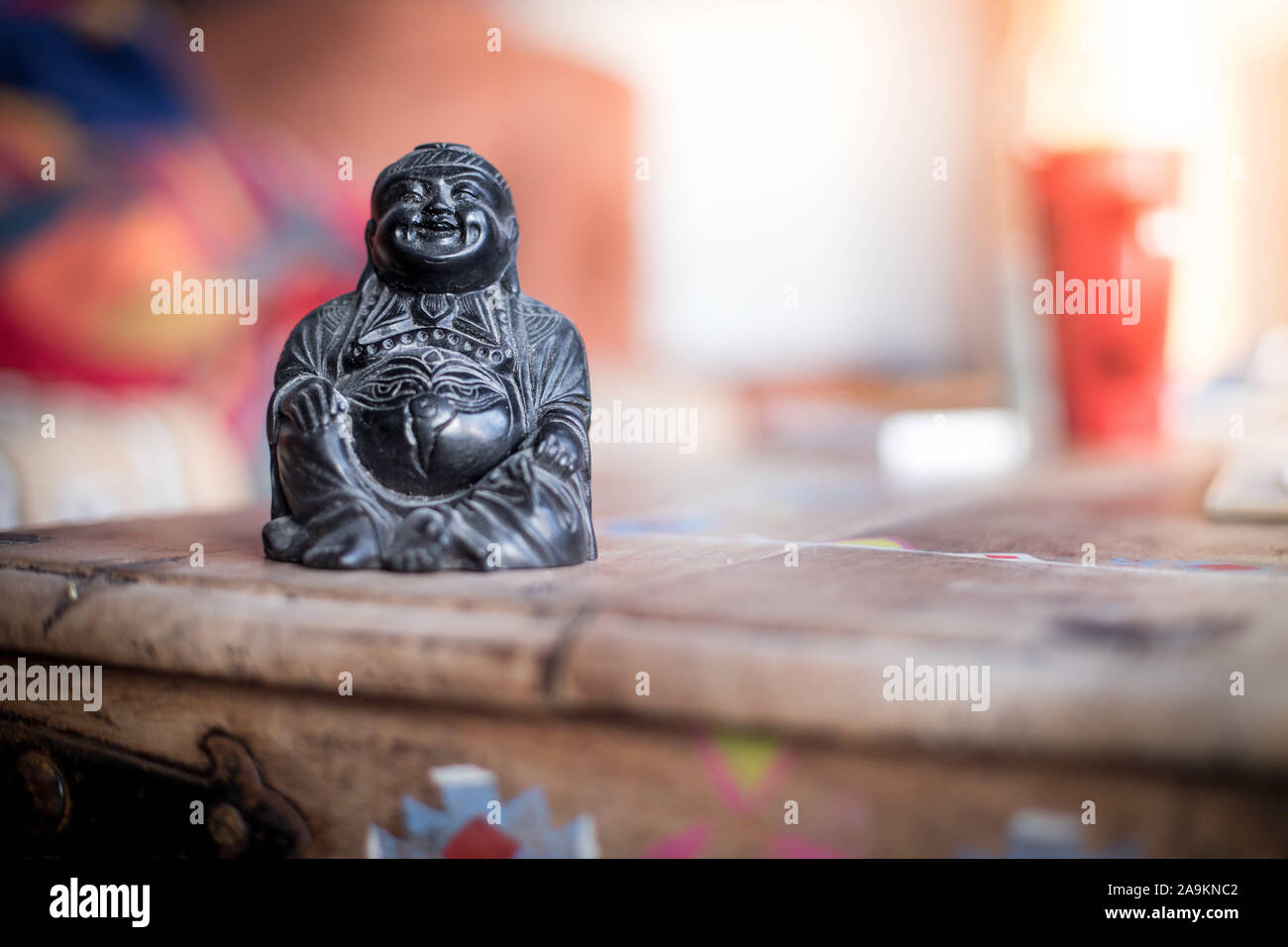 Feng shui: Buddha statue at on a table in the own living room Stock ...