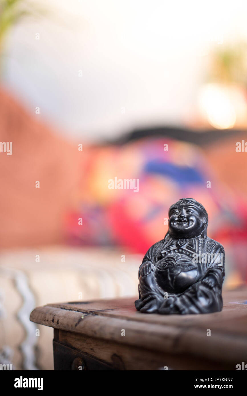 Feng shui: Buddha statue at on a table in the own living room Stock ...