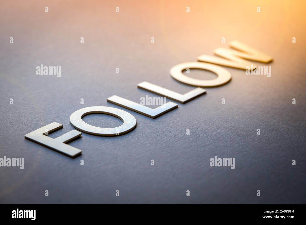 Word follow written with white solid letters on a board Stock Photo - Alamy