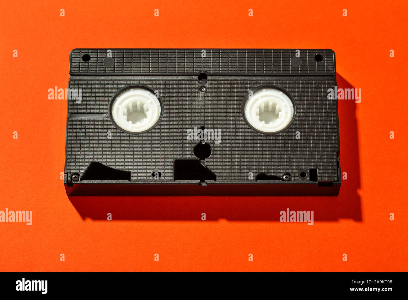 An old plastic video cassette for a film VCR against a bright ...