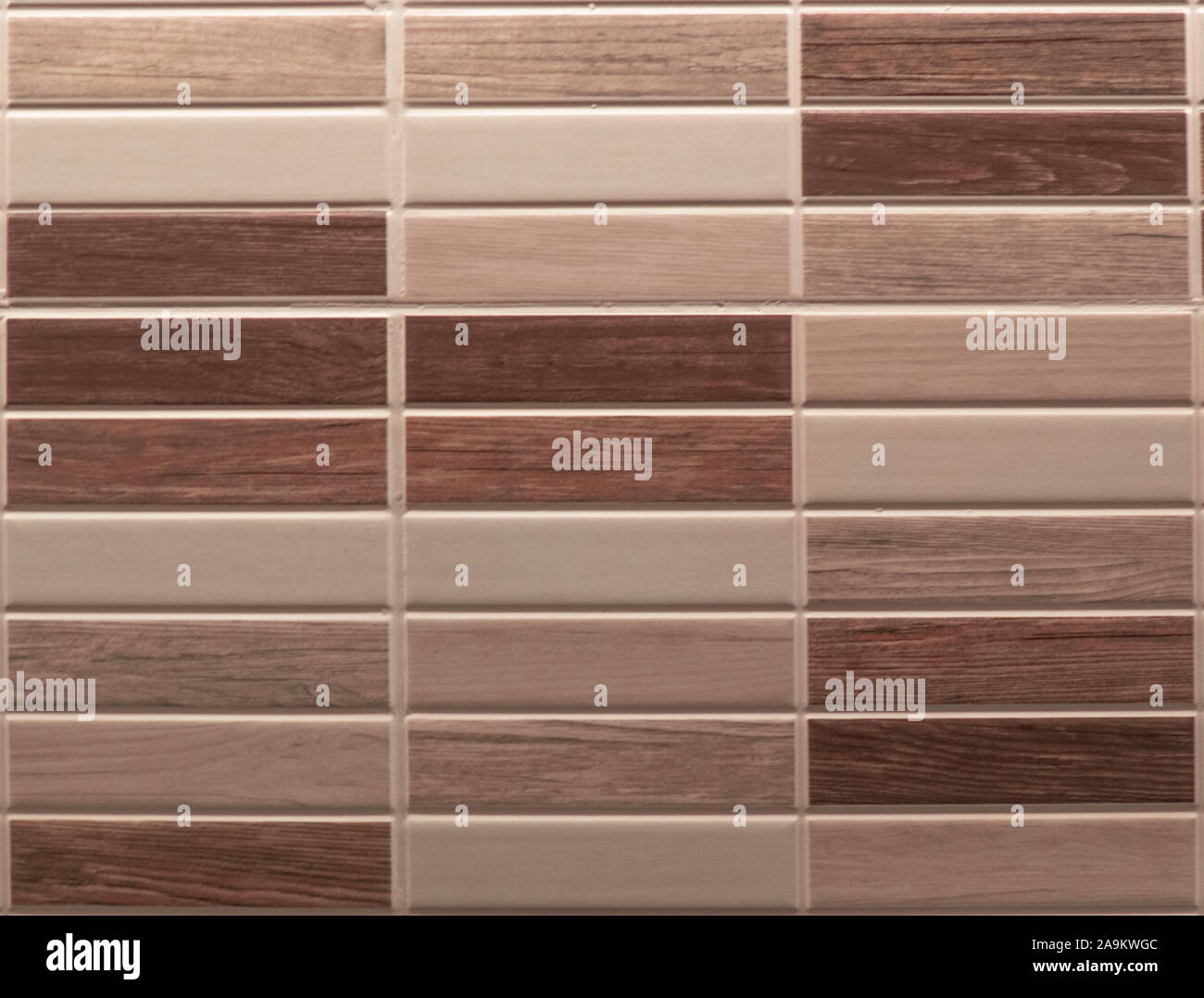 wall covered with rectangular ceramic tiles with various wood textures ...