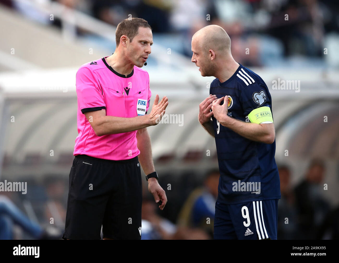 Referee Harald Lechner (left) has words with Scotland's Steven Naismith ...