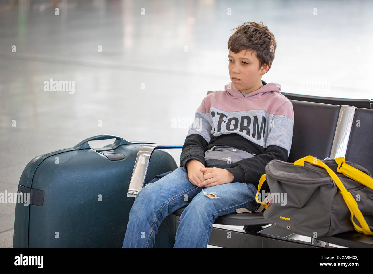 Boy waiting at gate hi-res stock photography and images - Alamy