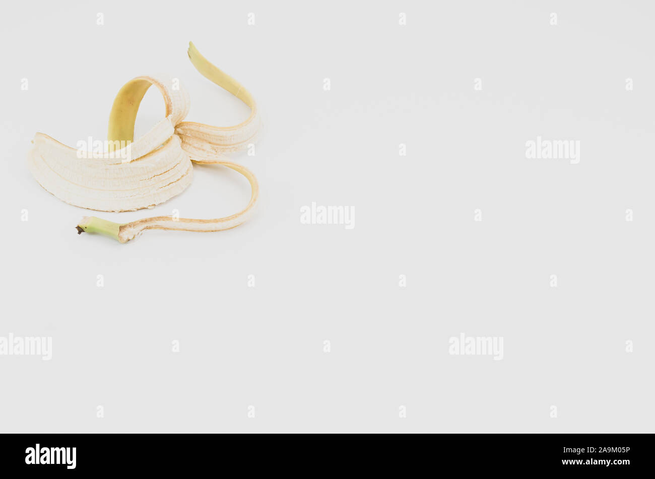 banana peel on a white background Stock Photo - Alamy