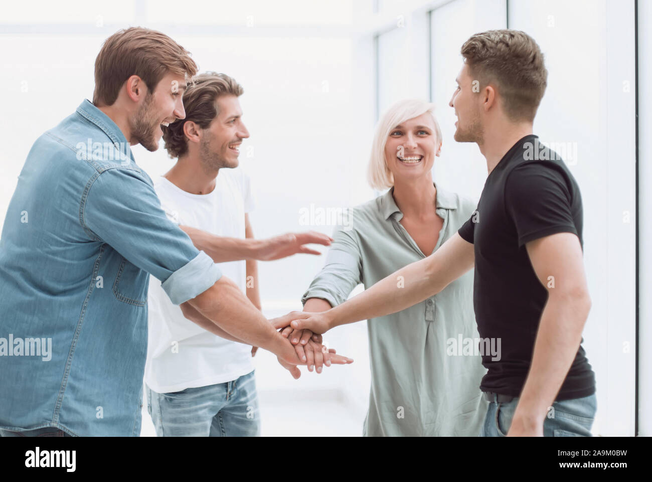 Workers putting hands together hi-res stock photography and images - Alamy