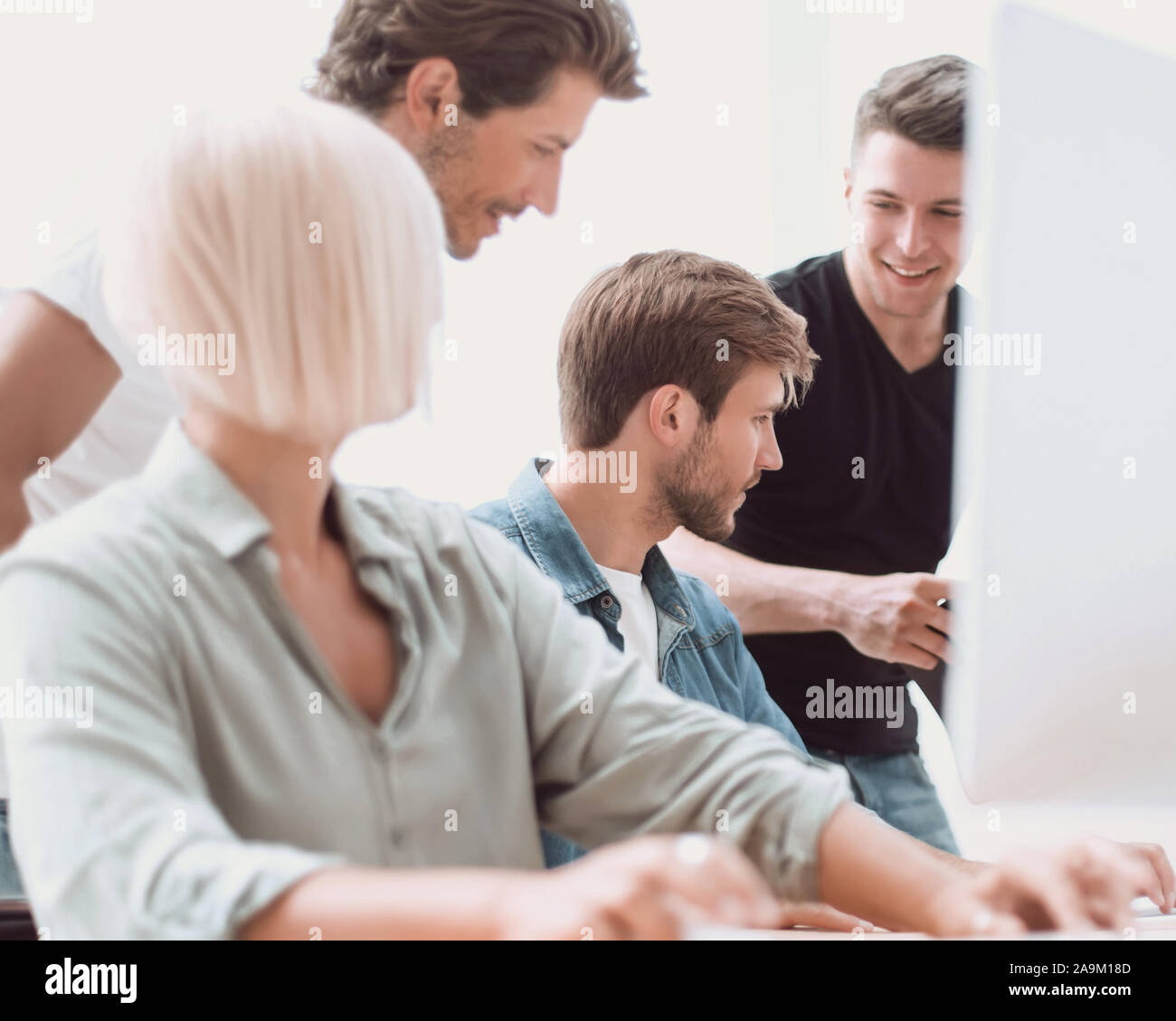 colleagues use a computer for office work Stock Photo - Alamy