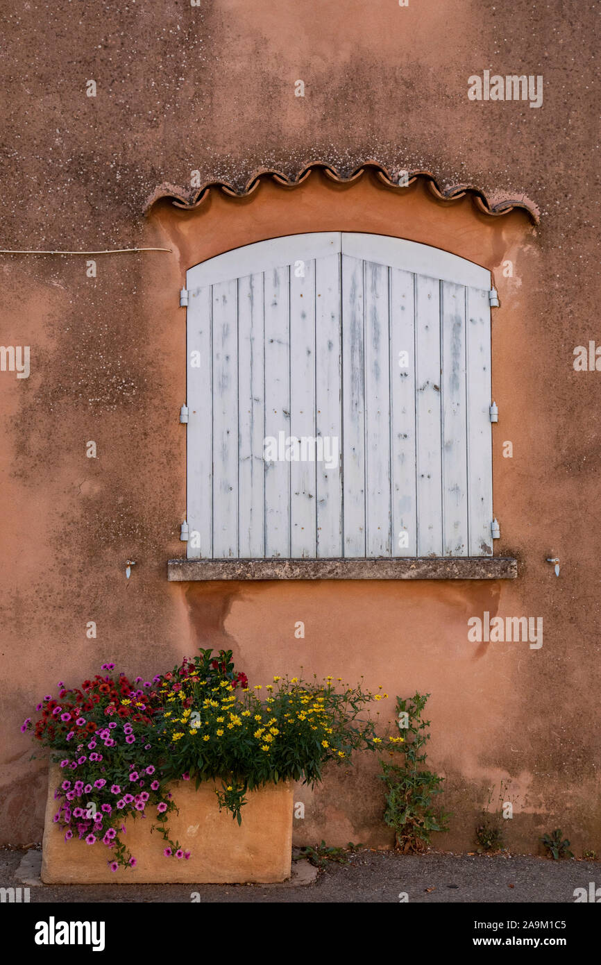 traditional window with plants in Roussillon Luberon France Provence ...
