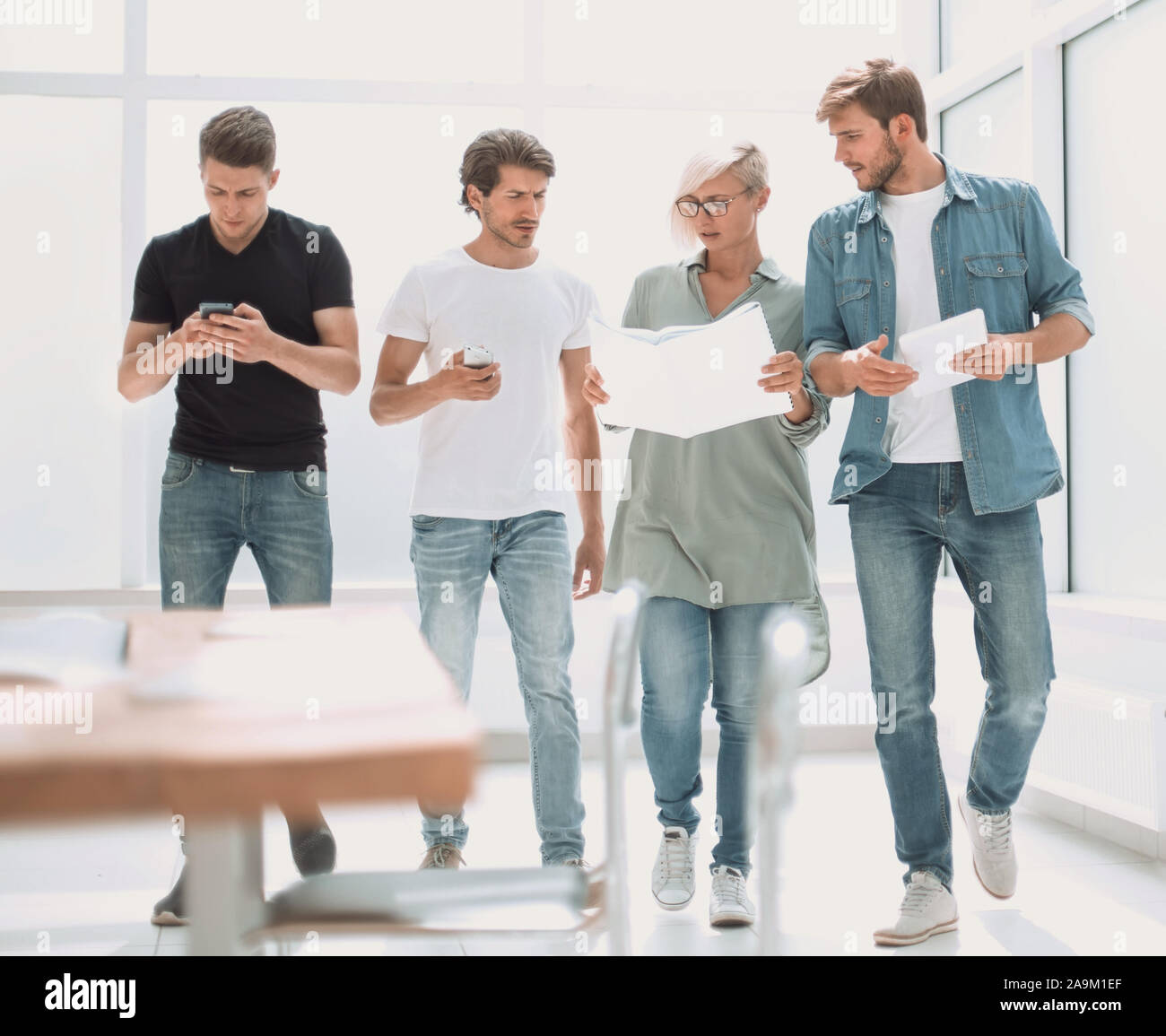 group of designers discussing ideas for a new project Stock Photo - Alamy