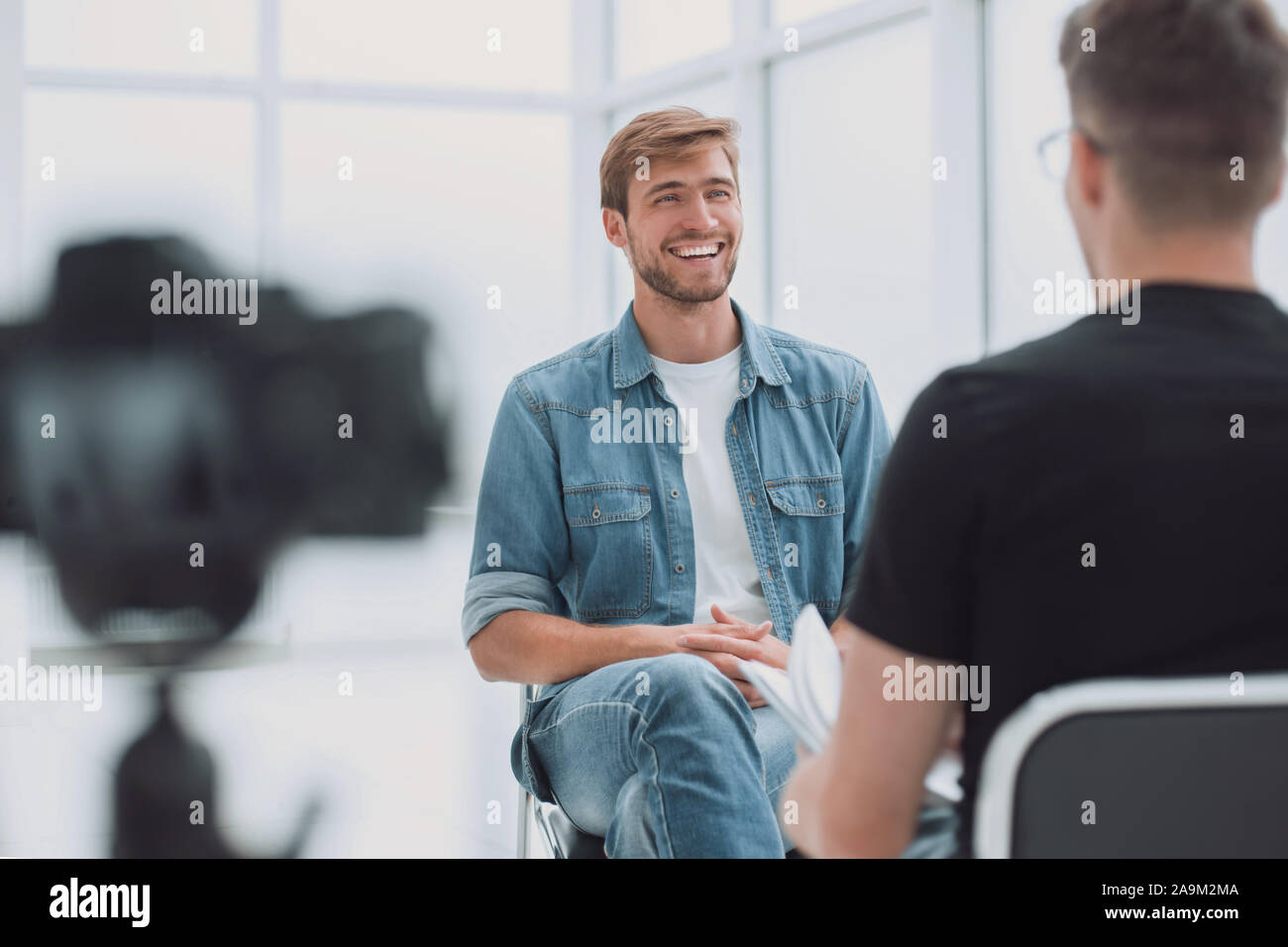 two young men talking in the TV Studio Stock Photo - Alamy