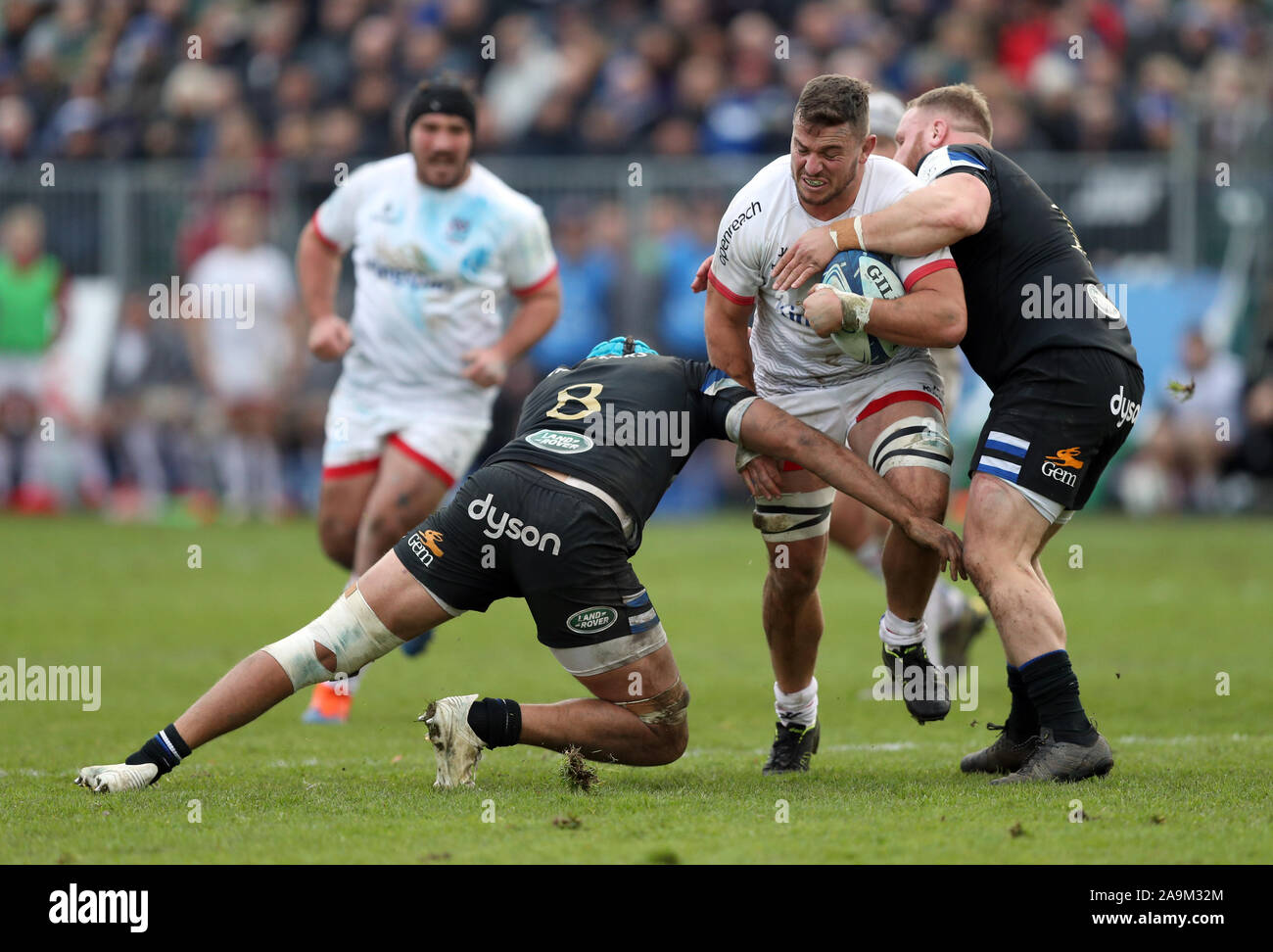 Ulster's Sean Reidy (centre) is tackled by Bath Rugby's Zach Mercer ...