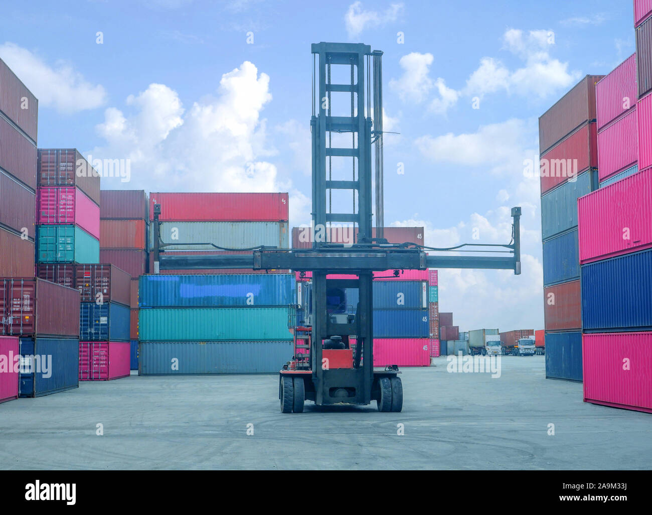 Container handlers In the shipping dock with storage cabinet background ...