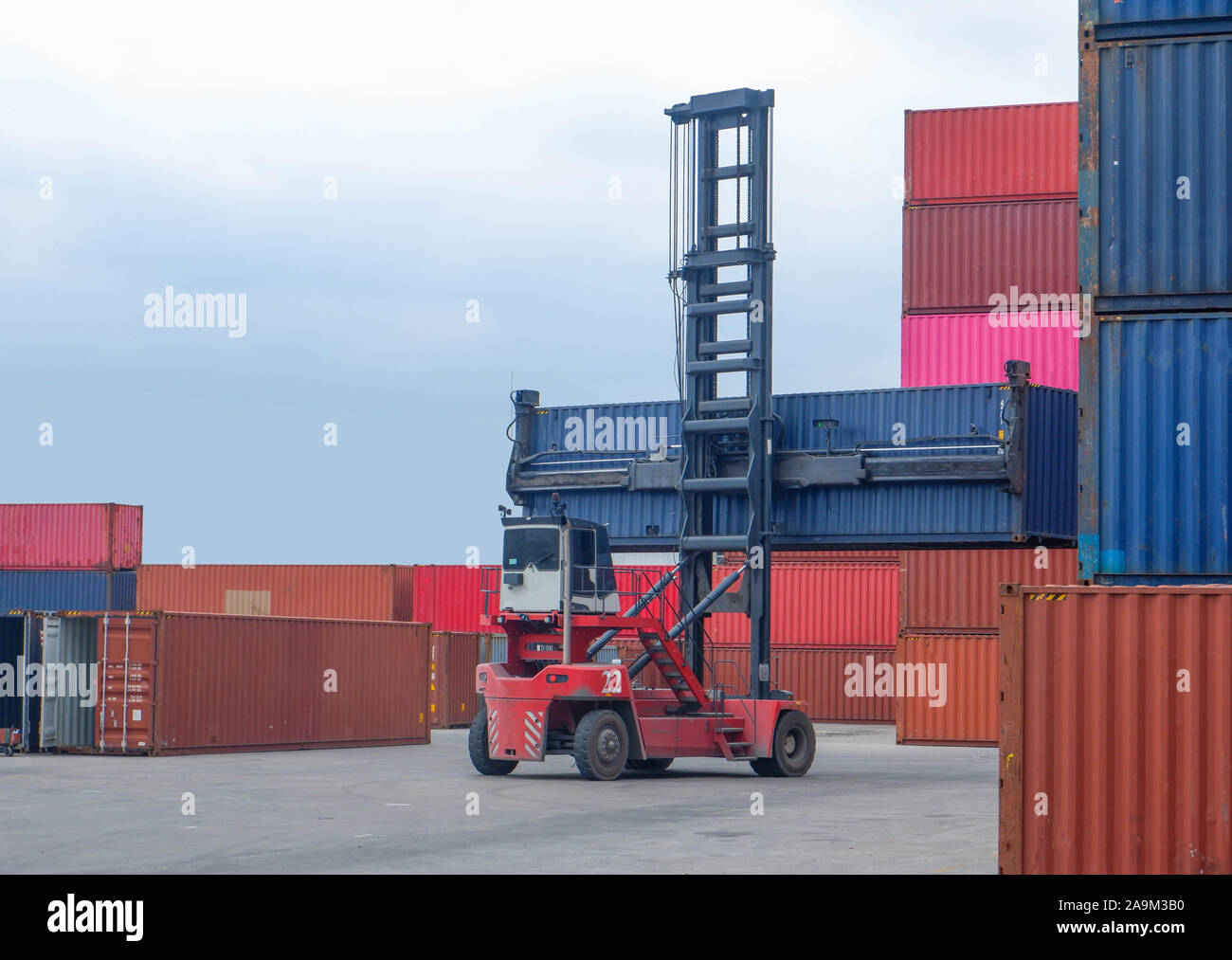 Container handlers In the harbor with storage cabinet background ...