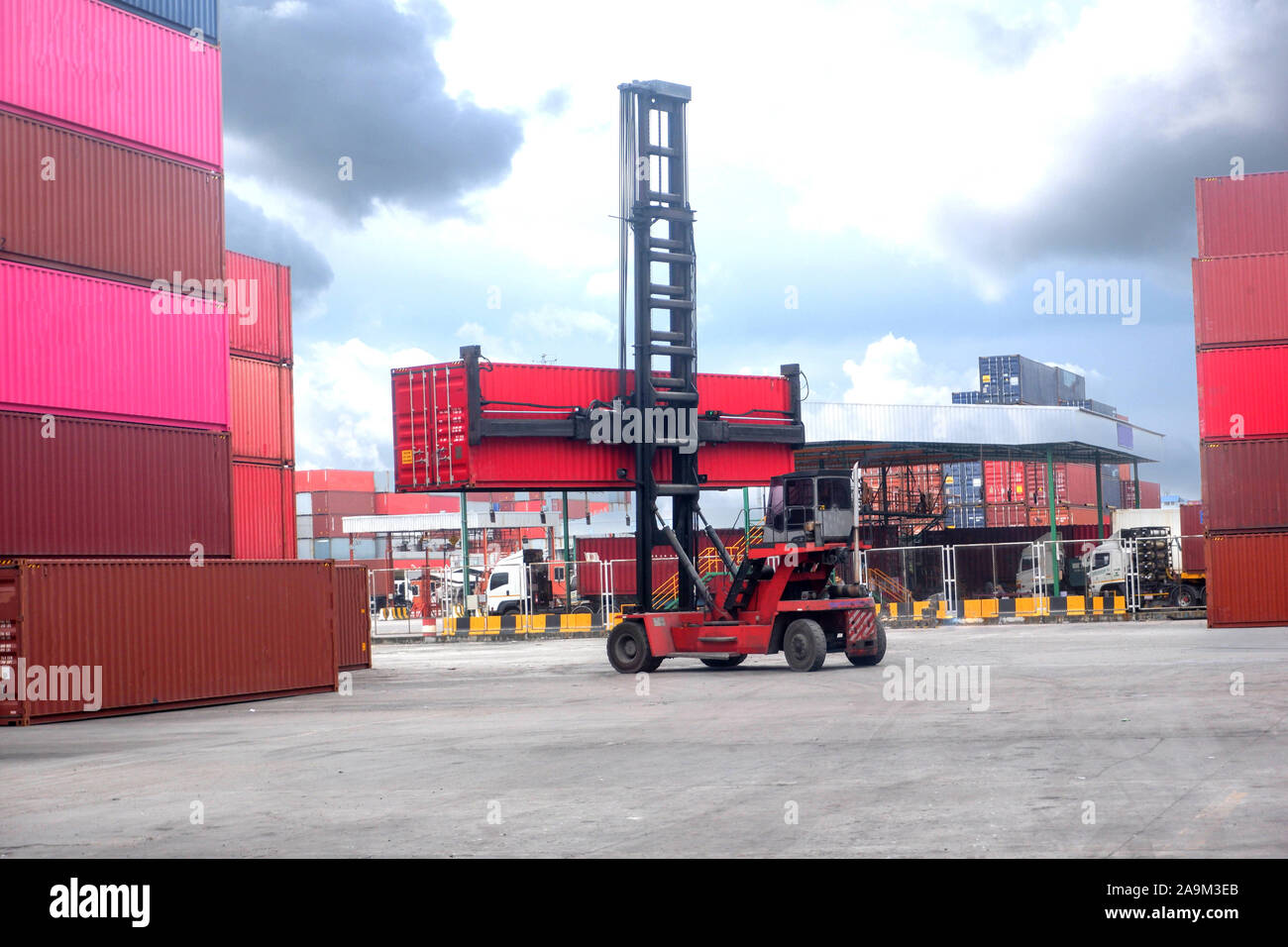 Container handlers In the harbor with storage cabinet background ...