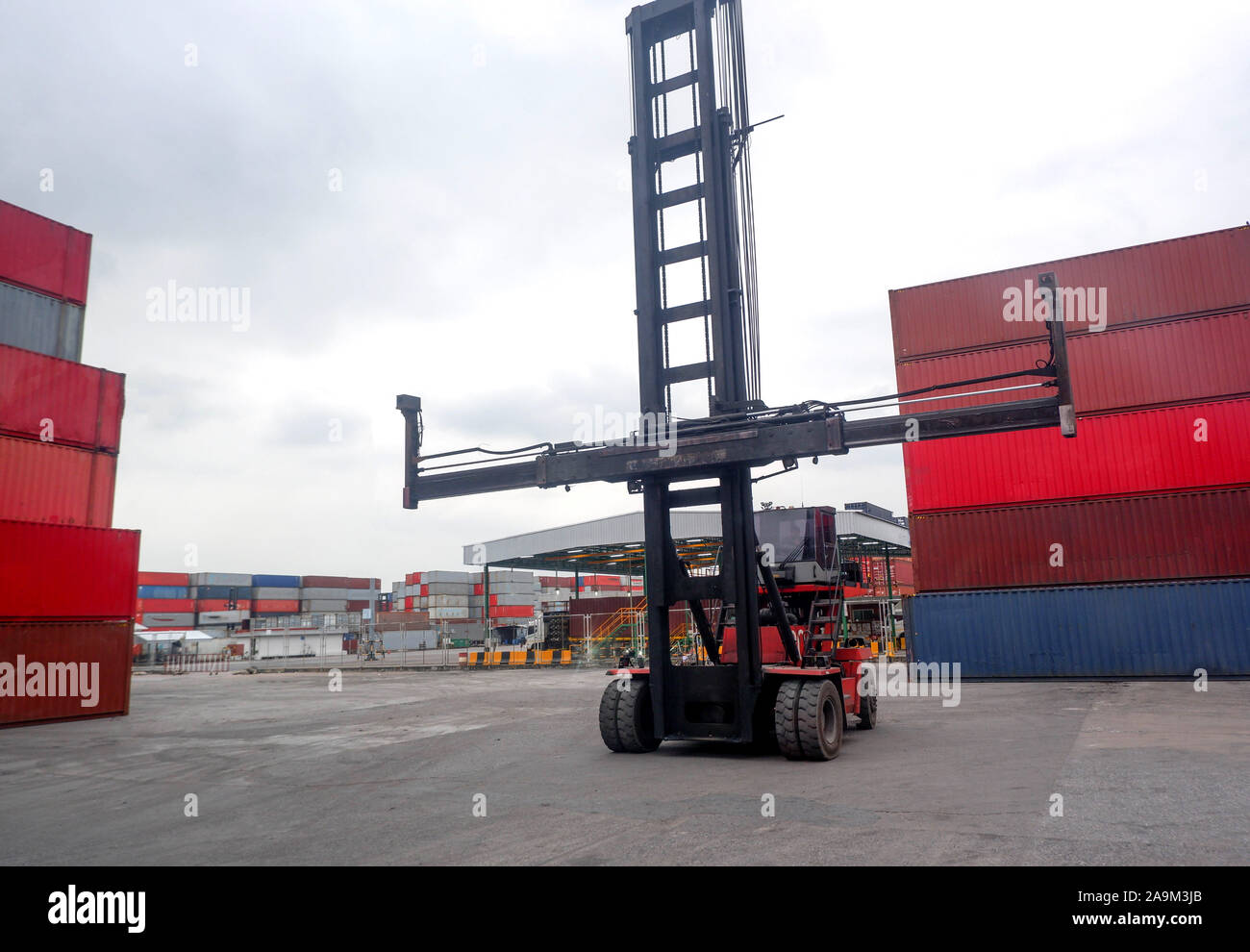 Container handlers In the harbor with storage cabinet background ...