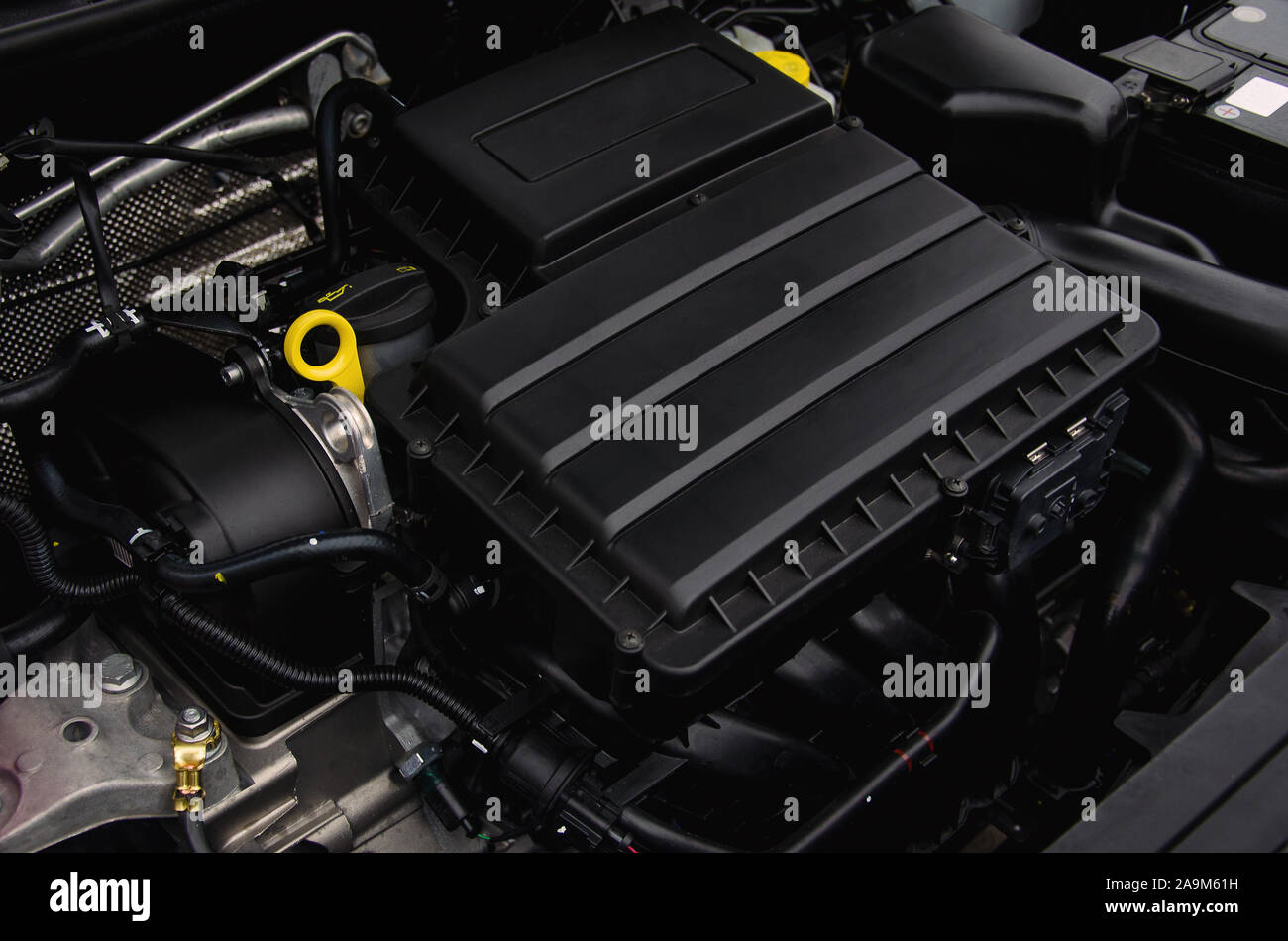 Photo of a new car engine covered with a plastic casing Stock Photo - Alamy