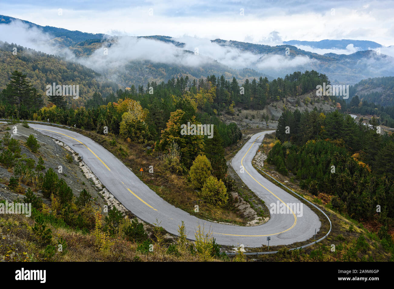 Landscape with autumn colorful foliage and winding road on Mount ...