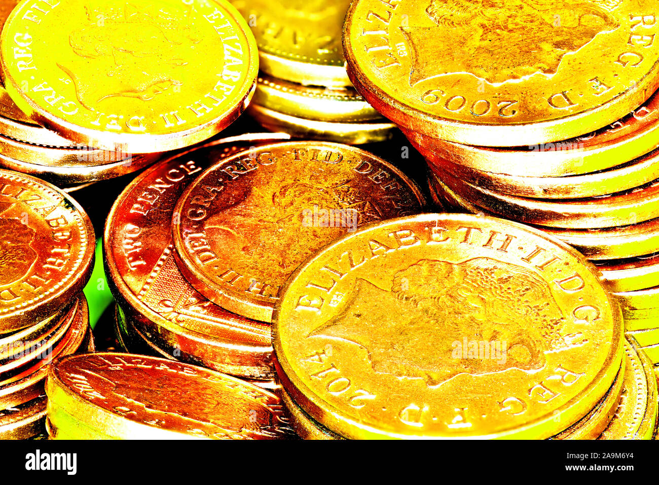 Golden money coins Stock Photo - Alamy