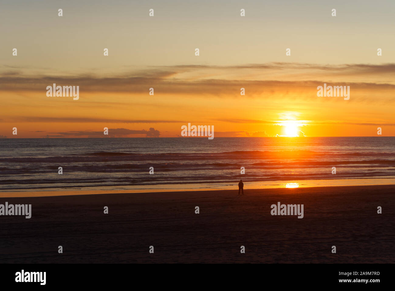 Beach sunset shadow man Stock Photo - Alamy