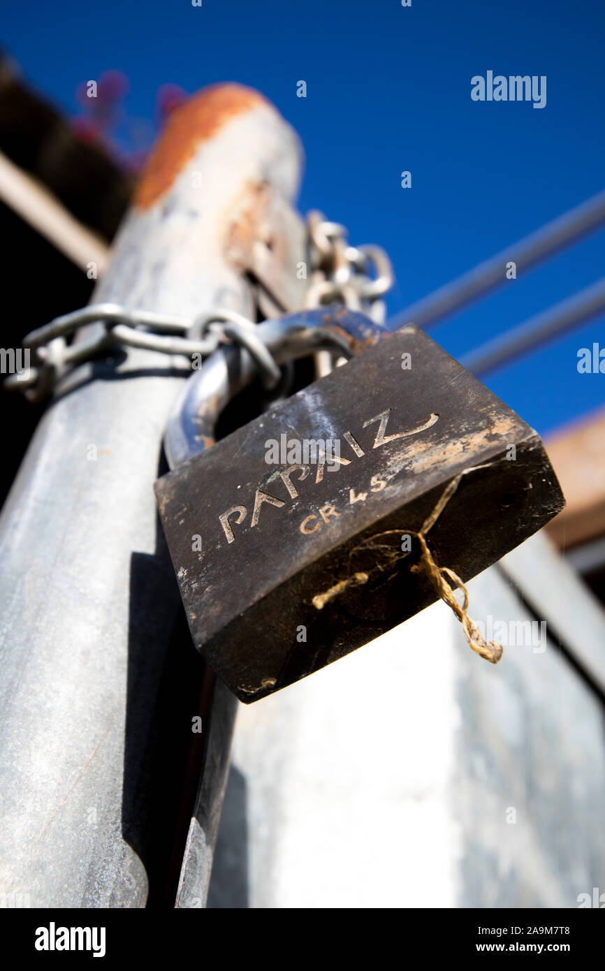 padlock and chain on steel gate providing security to building ...
