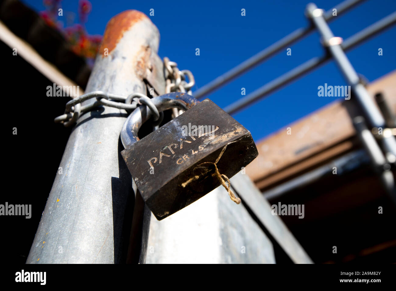 padlock and chain on steel gate providing security to building ...