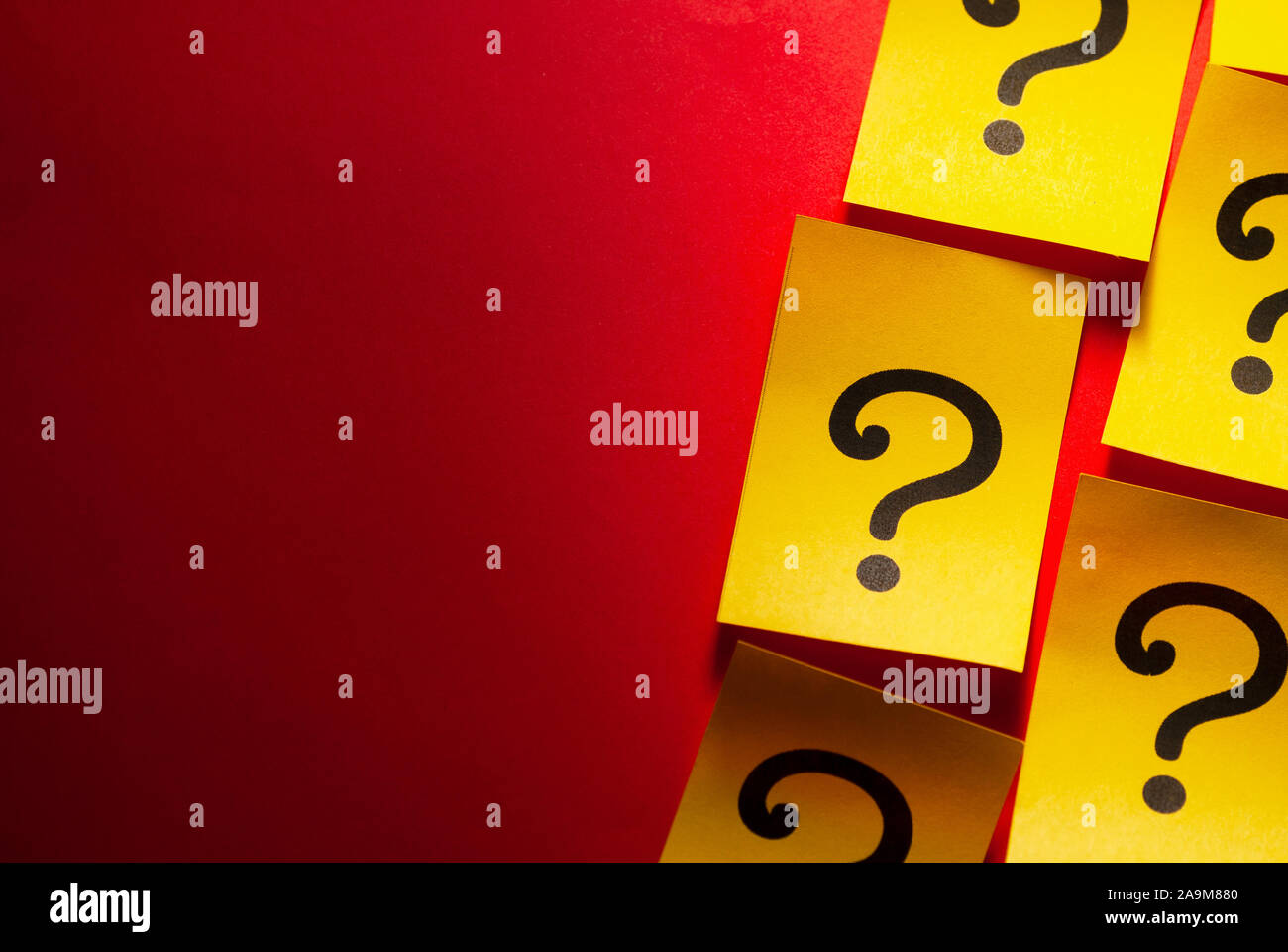 Side border of yellow cards with question marks arranged in rows on a ...