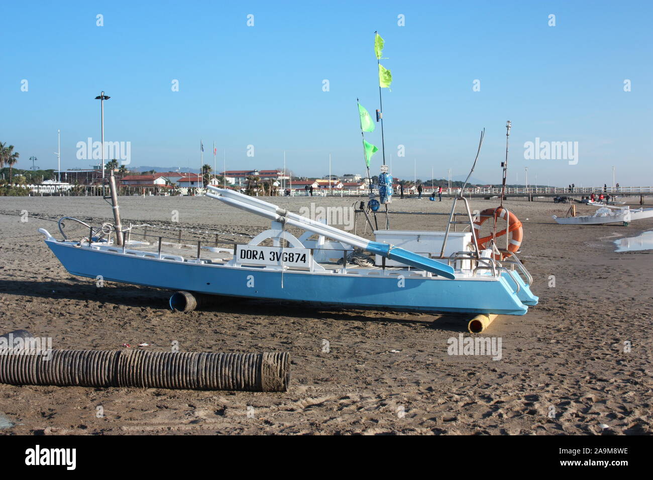 a life raft. a boat stranded or parked on the sandy beach in broad ...