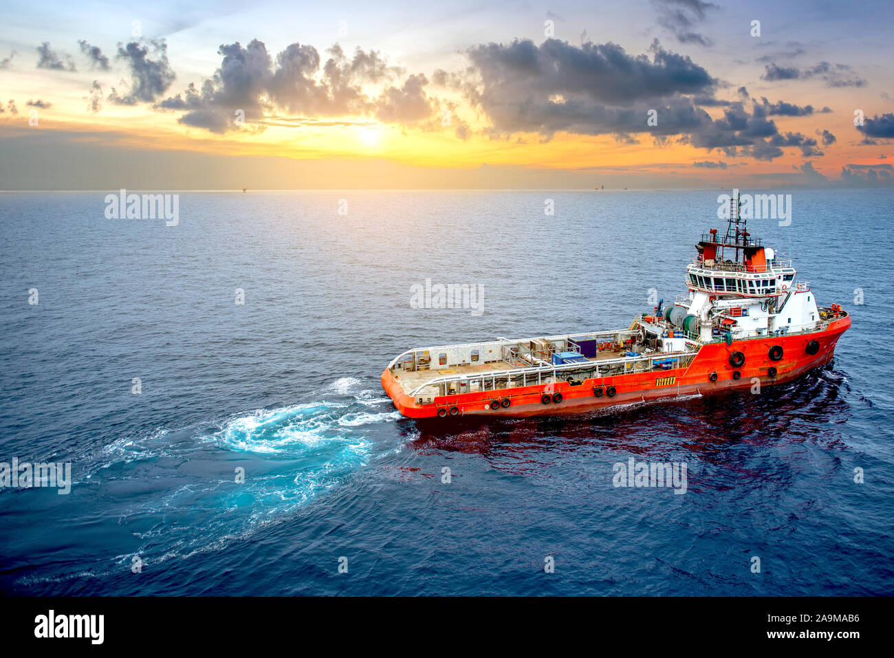 Shipping box is loaded from an offshore rig to the supply vessel Stock ...