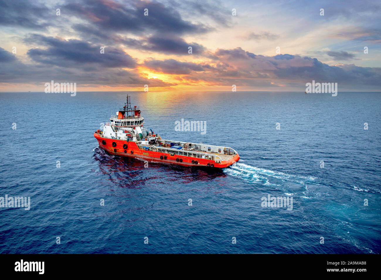 Shipping box is loaded from an offshore rig to the supply vessel Stock ...