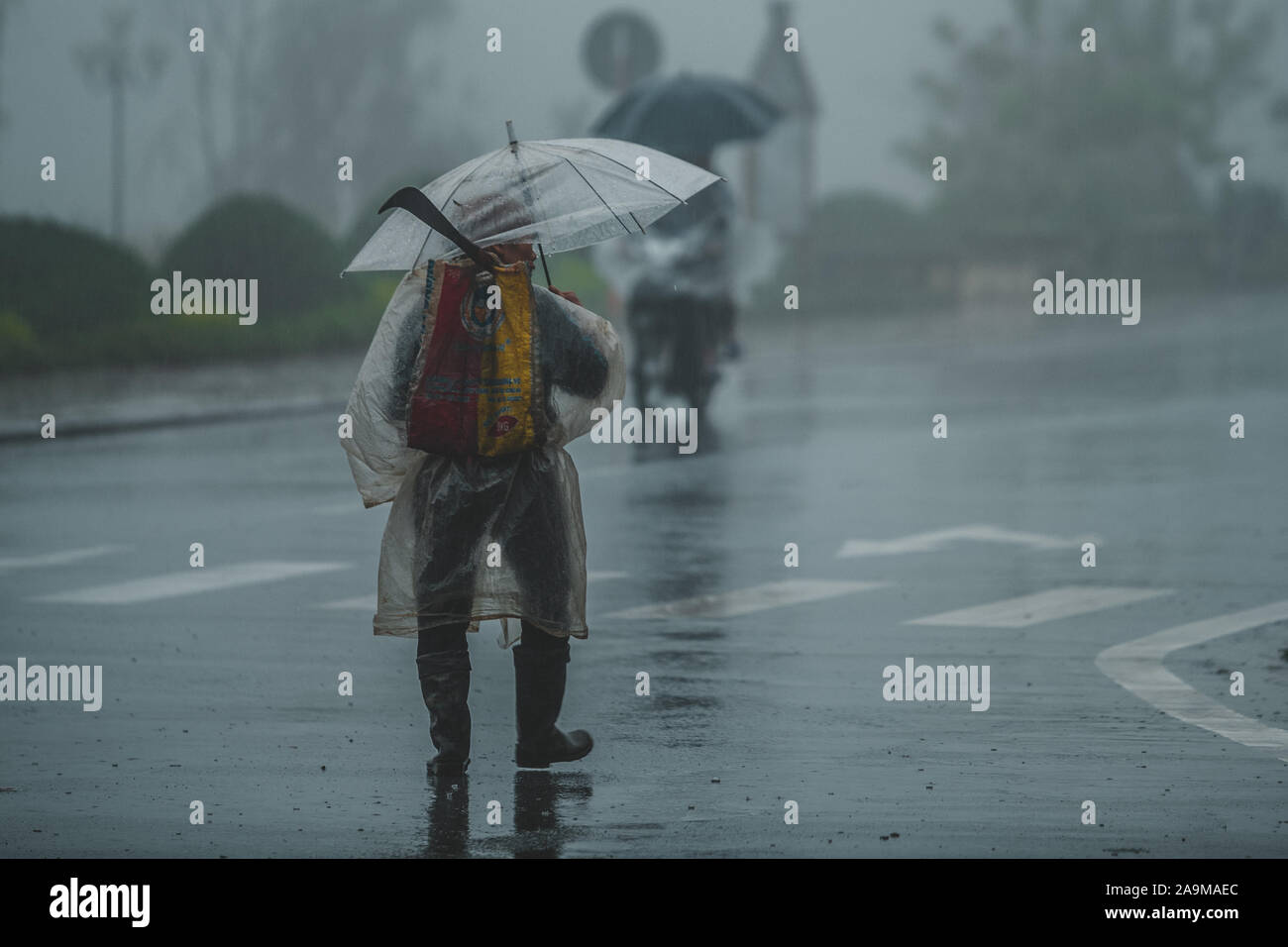 Man Walking Away In Rain