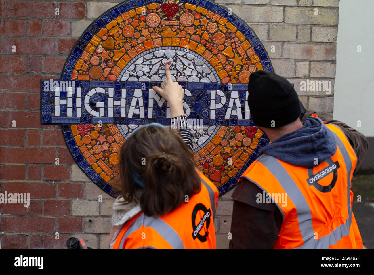 finishing touches being made to Mosaic Roundel on London Overground ...