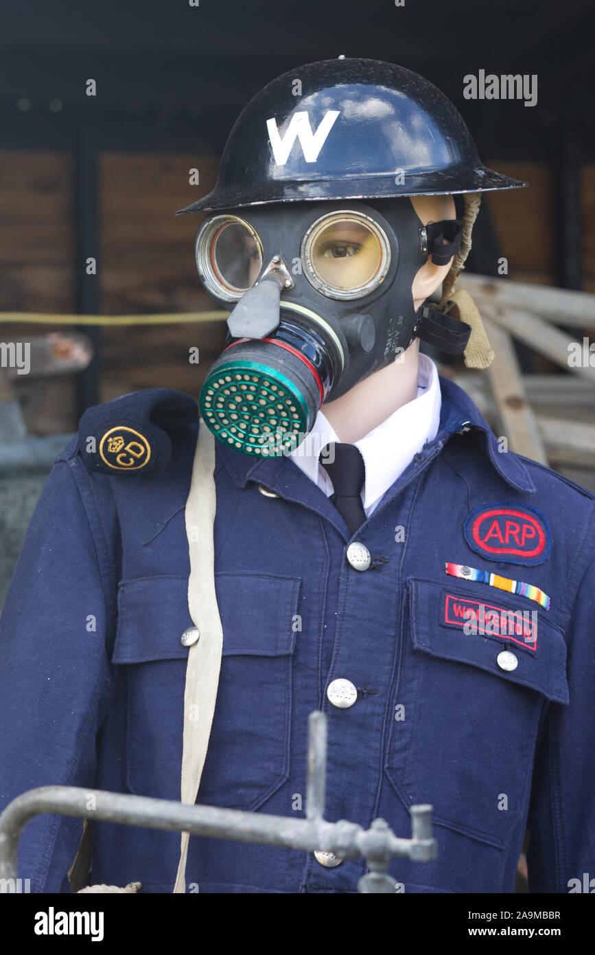 Mannequin dressed in Air Raid Precautions uniform and wardens helmet ...